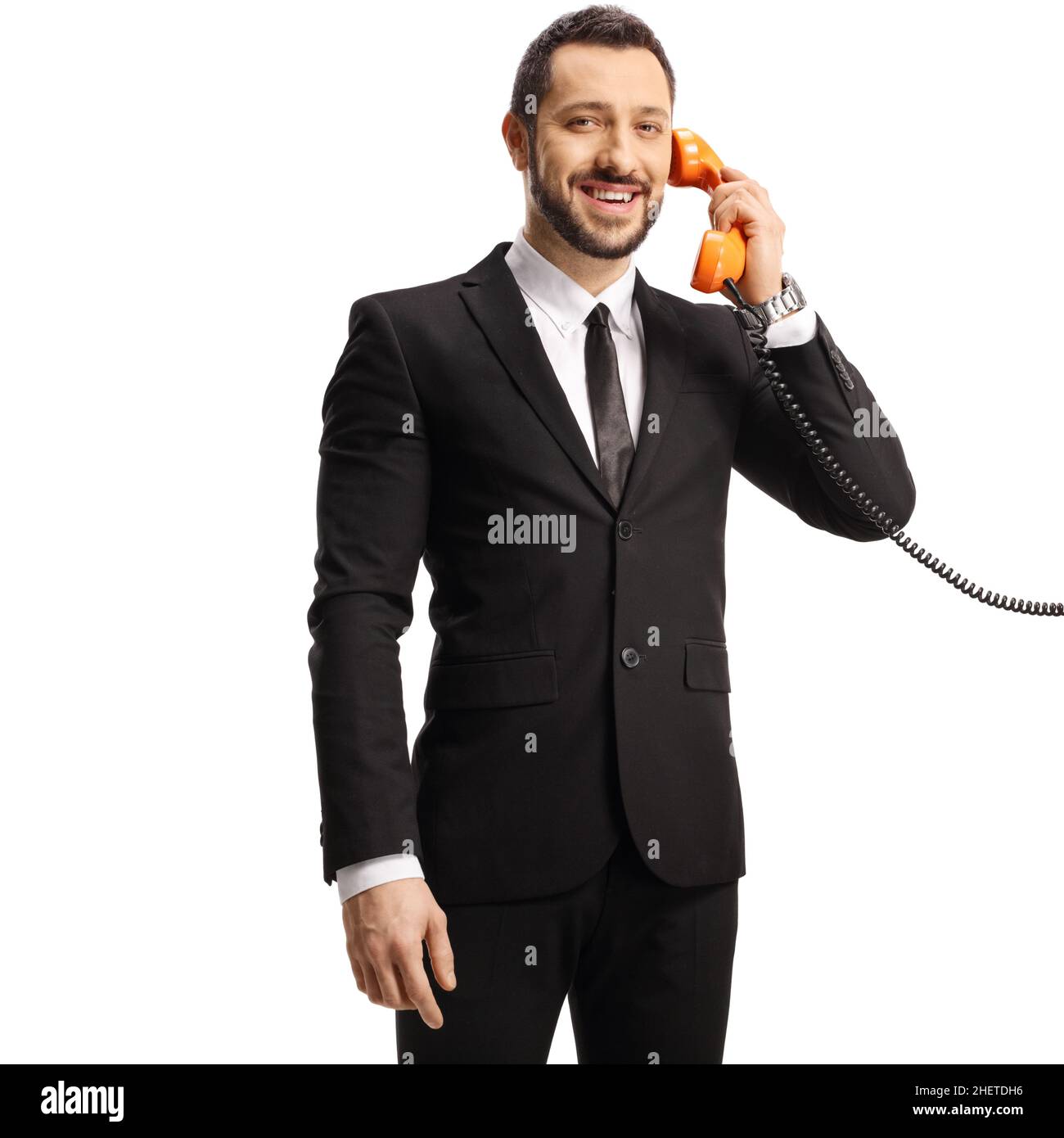 Businessman making a phone call with an old vintage rotary phone and ...