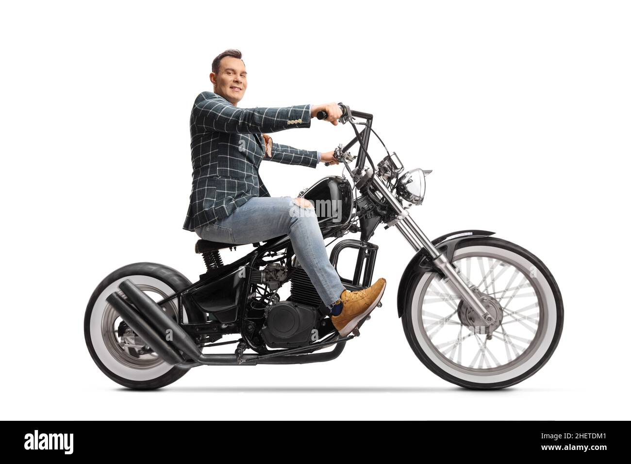 Man in stylish clothes riding a chopper motorbike isolated on white ...