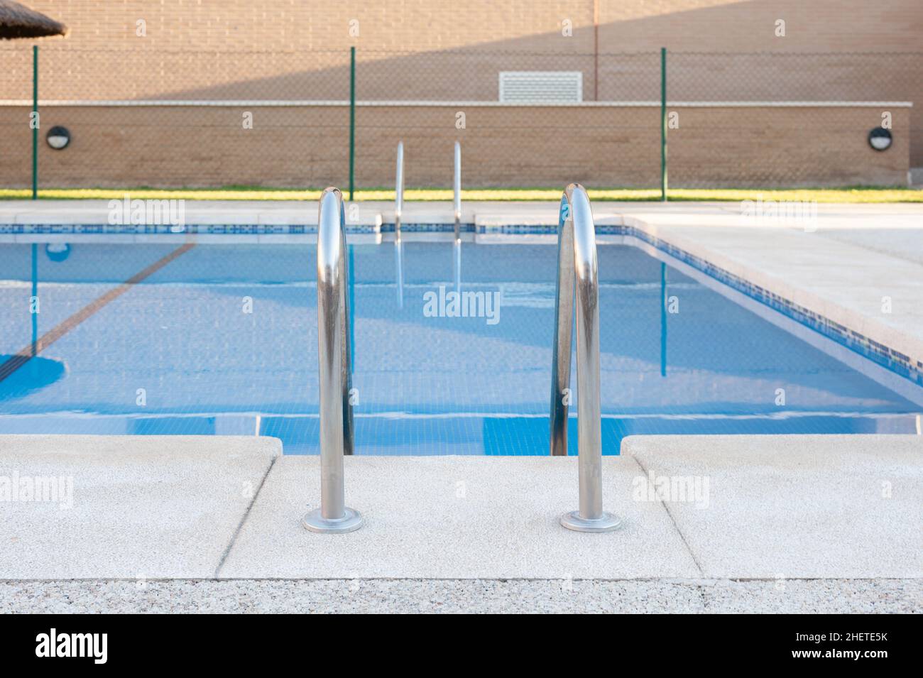 calm pool blue water stair curb summer calm Stock Photo - Alamy