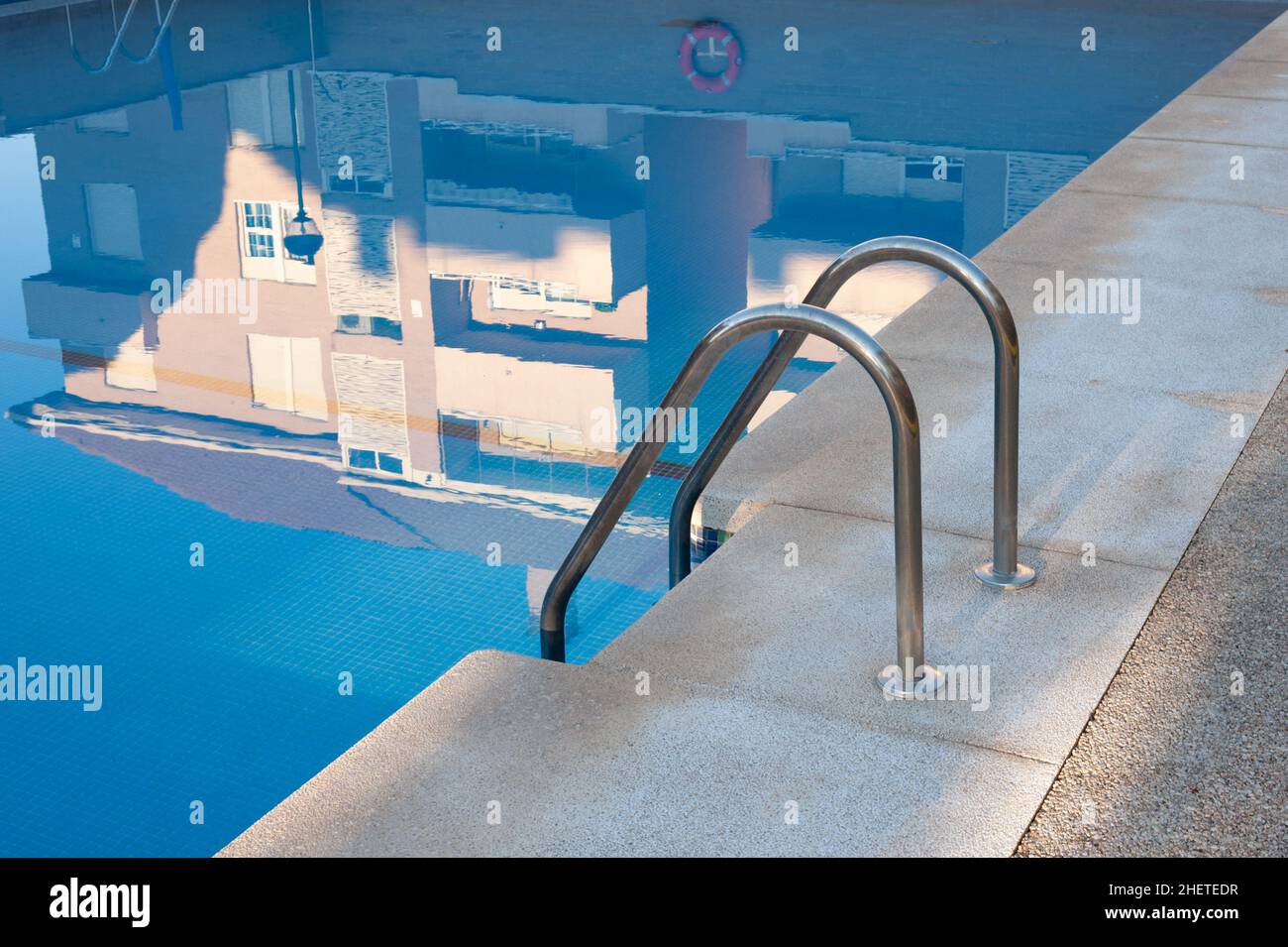 calm pool blue water stair curb summer calm Stock Photo - Alamy