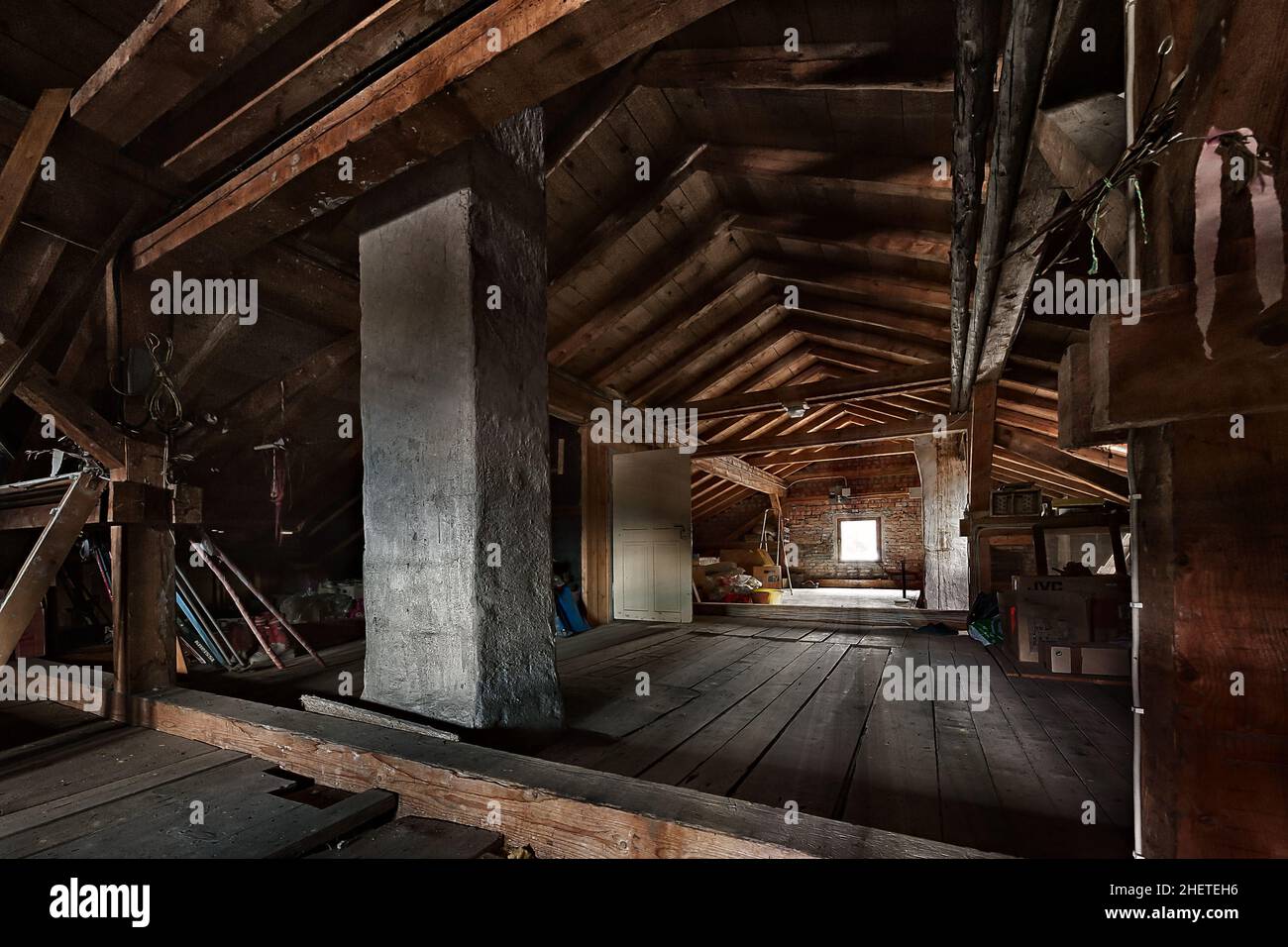 old wooden attic with roof framework structure and window Stock Photo ...