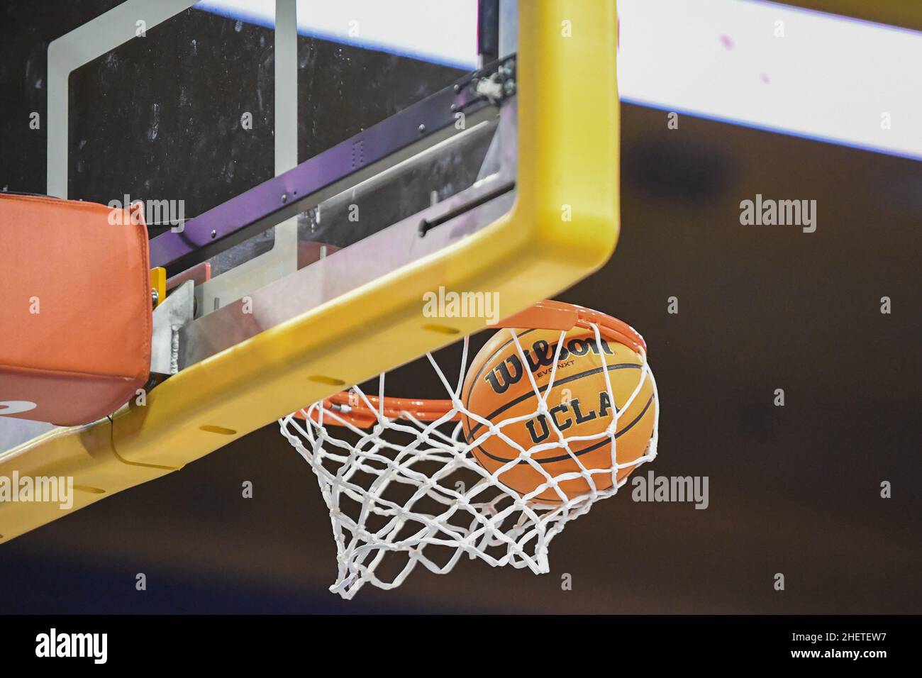 Detailed view of a NCAA Wilson basketball with UCLA branding going into ...