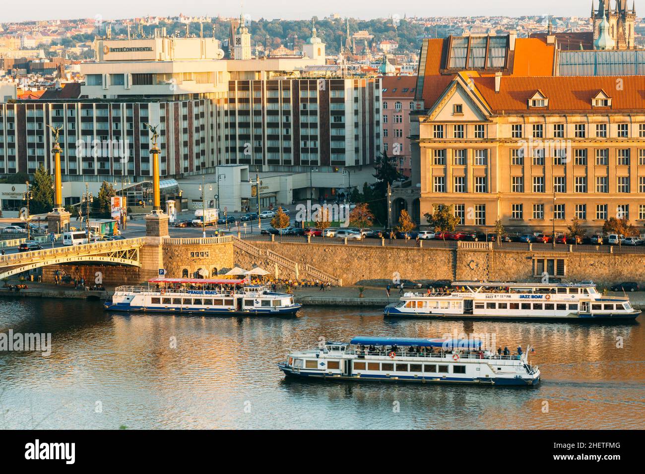 Tourist cruise ships sailing on the Vltava River in Prague, Czech ...