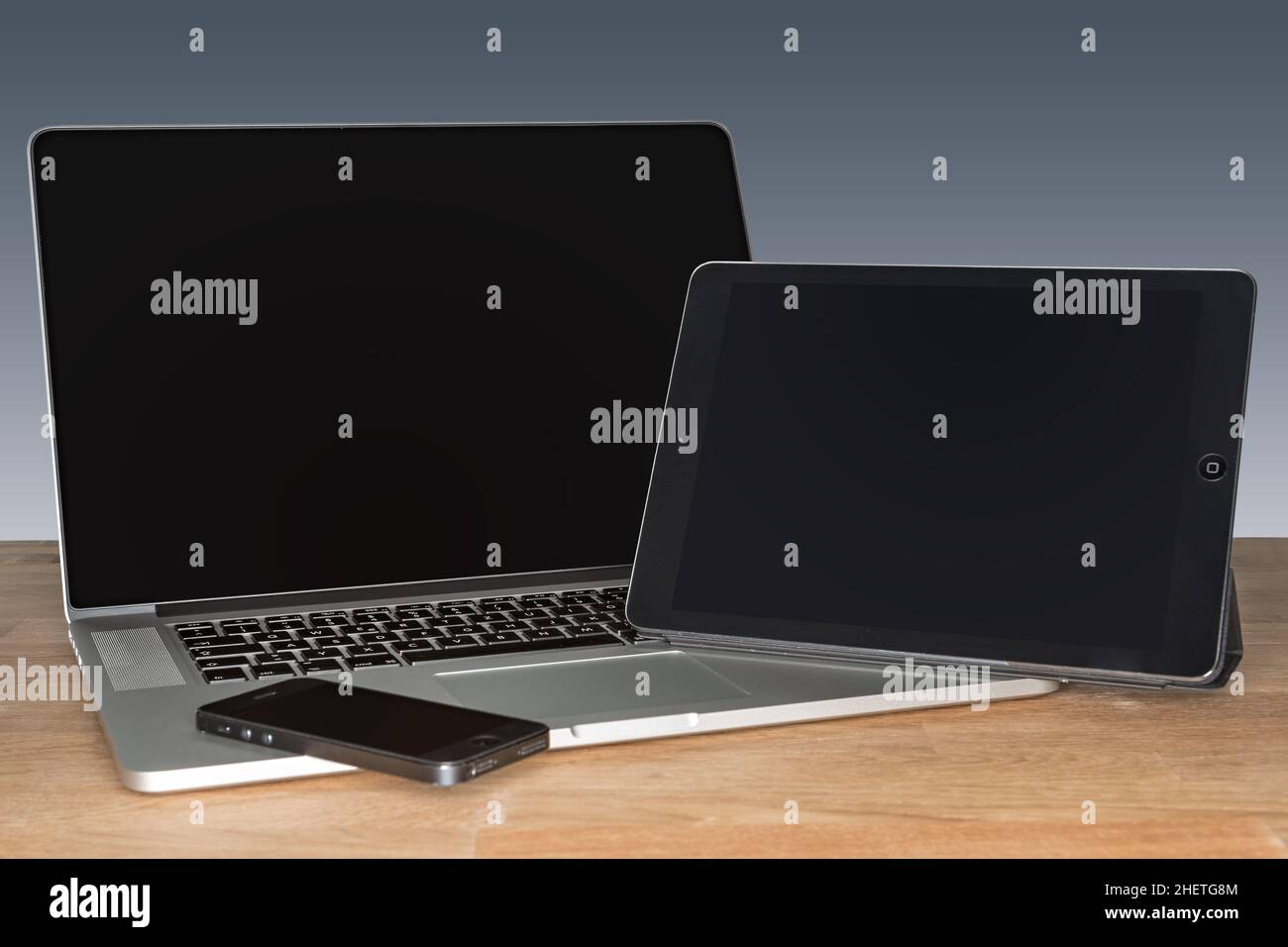 three portable mobile devices as notebook, tablet and phone Stock Photo ...