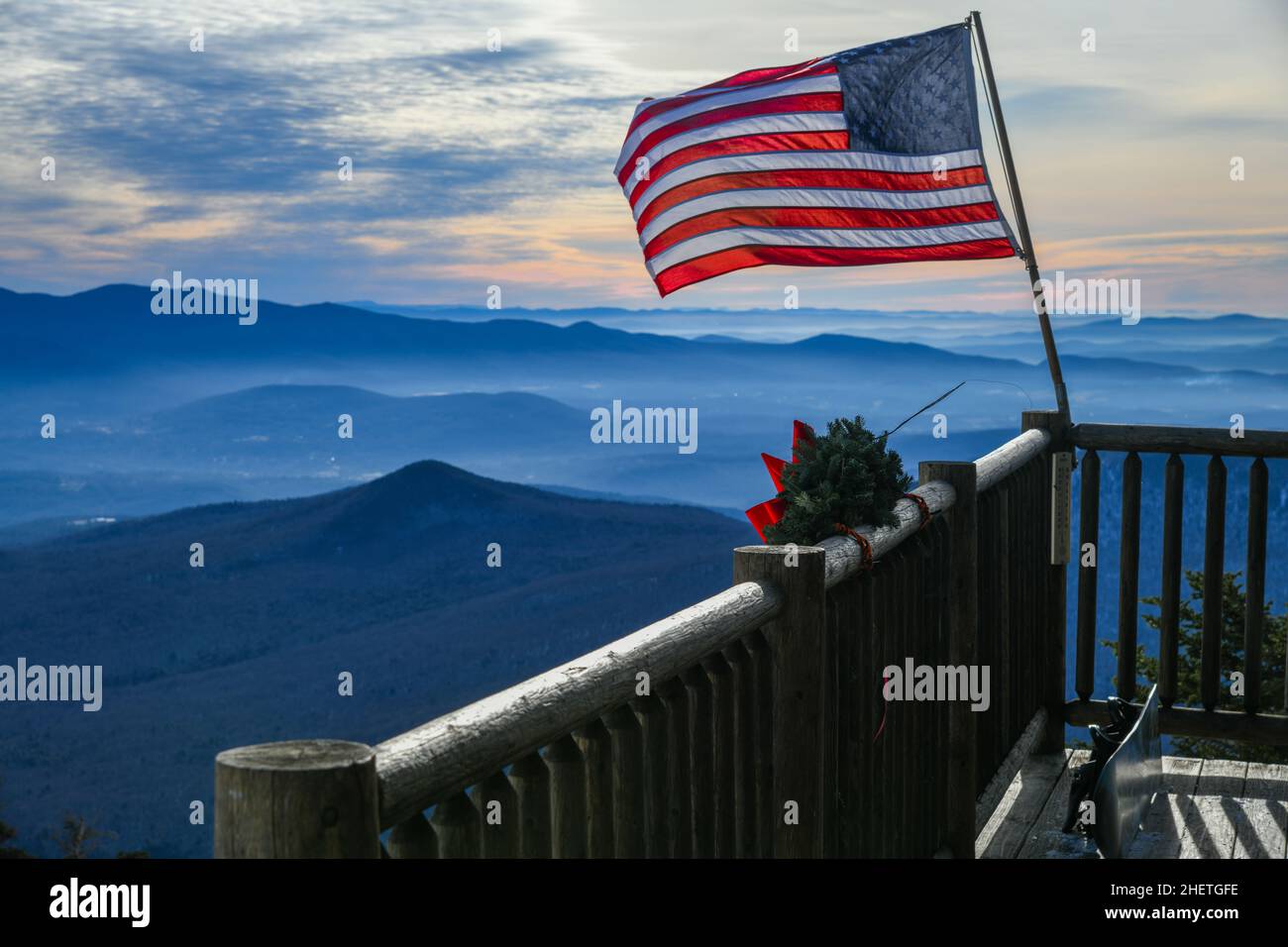 American flag waiving at the ski patrol house on the beautiful winter ...