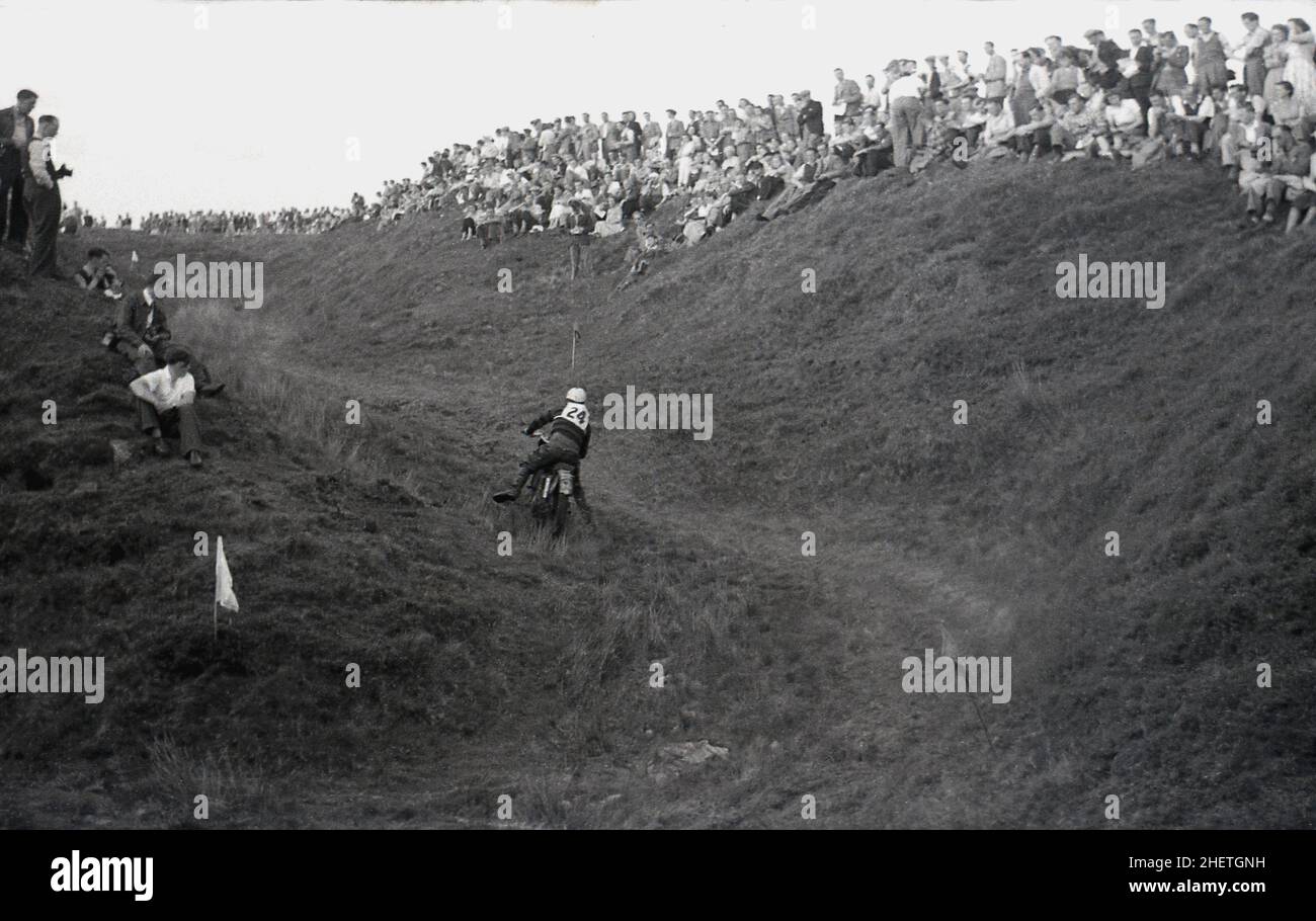 1950s, historical, motorcycle trials, spectators watching event on ...