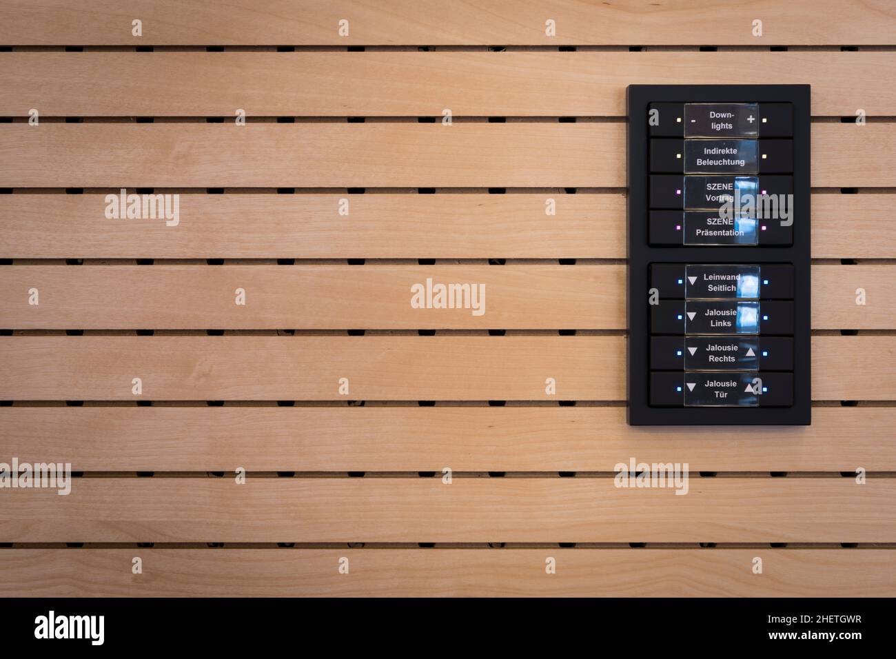 black switches for light control on wooden acoustic wall Stock Photo ...
