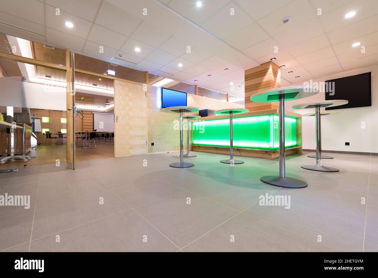 low view to wooden foyer with illuminated bar desk Stock Photo - Alamy