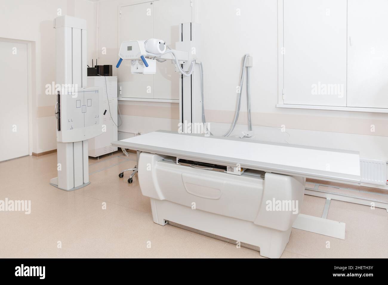 X-ray department in modern hospital. Radiology room with scan machine ...
