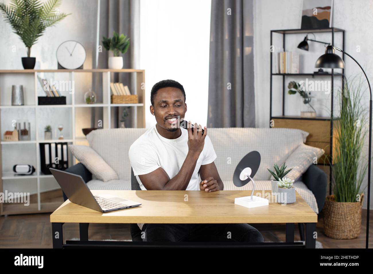 The concept of modern life, hygiene and beauty. Sporty happy African ...