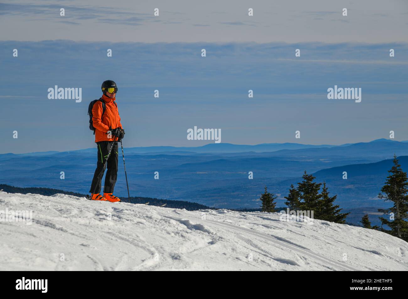 Skier standing on the top of Peak Mansfield Summit at Stowe Vermont ...