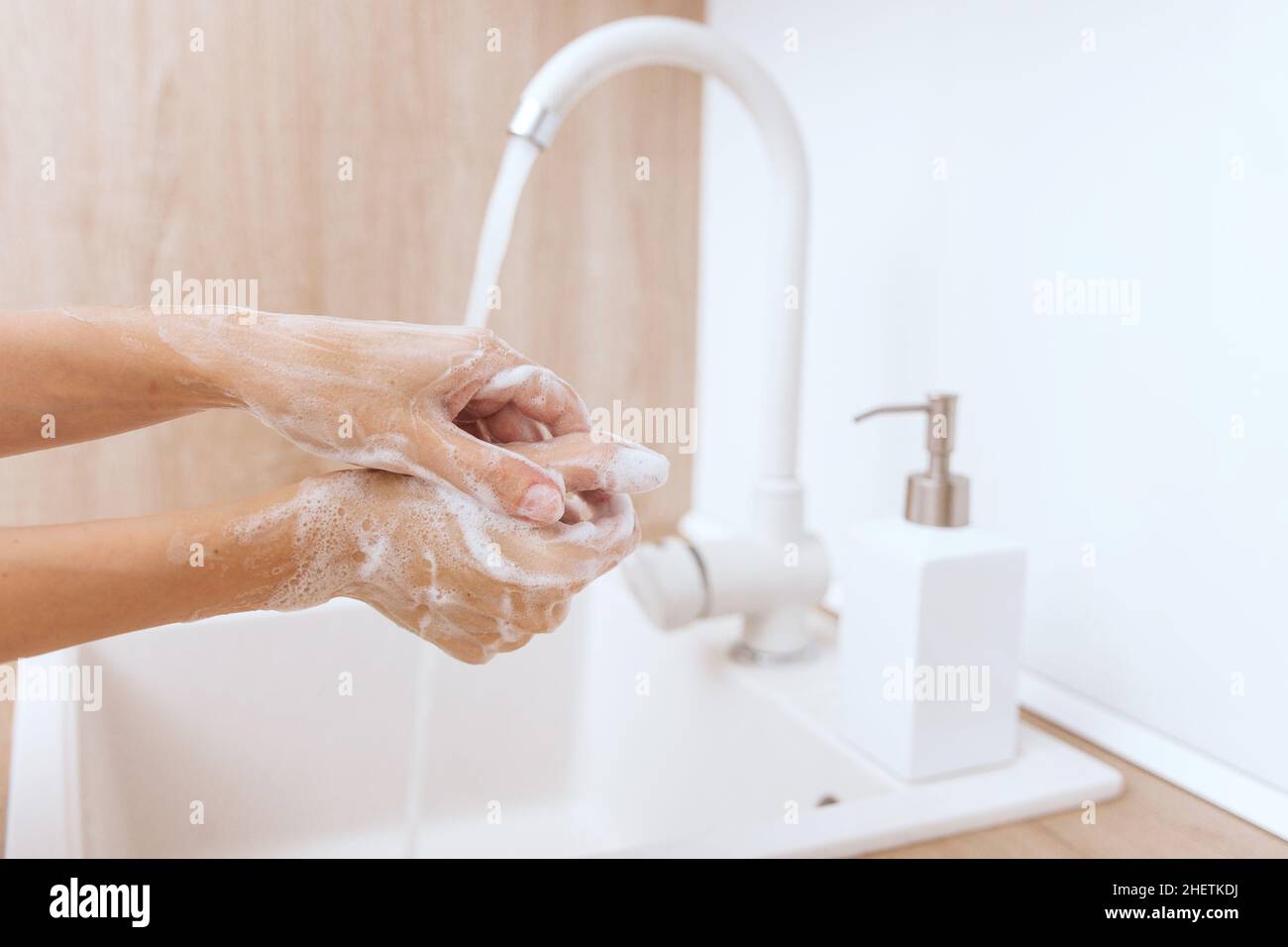 Washing hands under the flowing water tap. Hygiene concept hand detail ...
