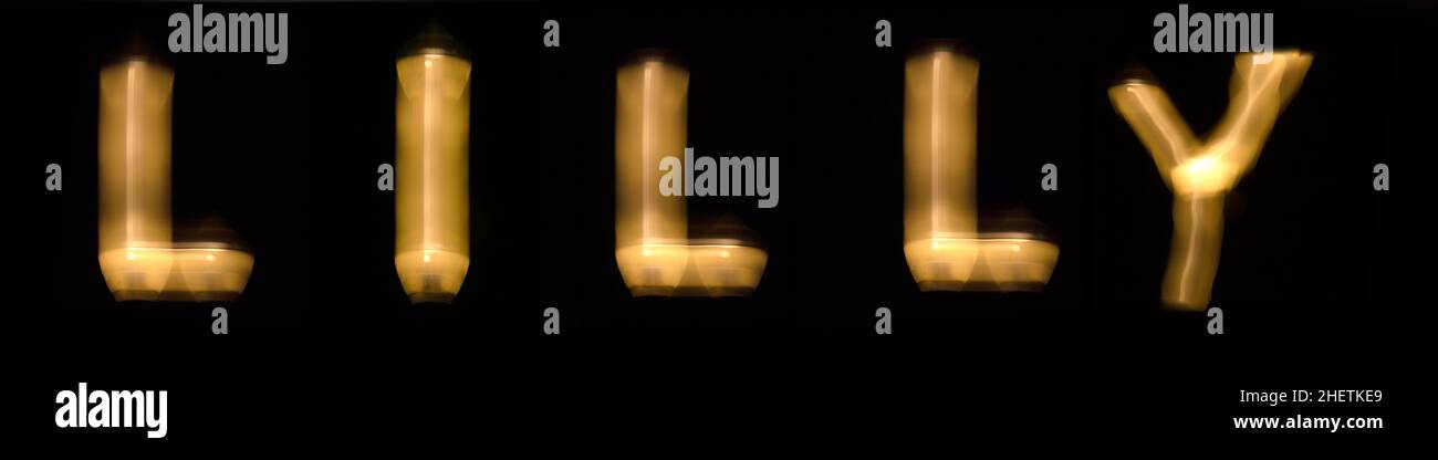 name Lilly painted with torch in the dark night sky Stock Photo - Alamy