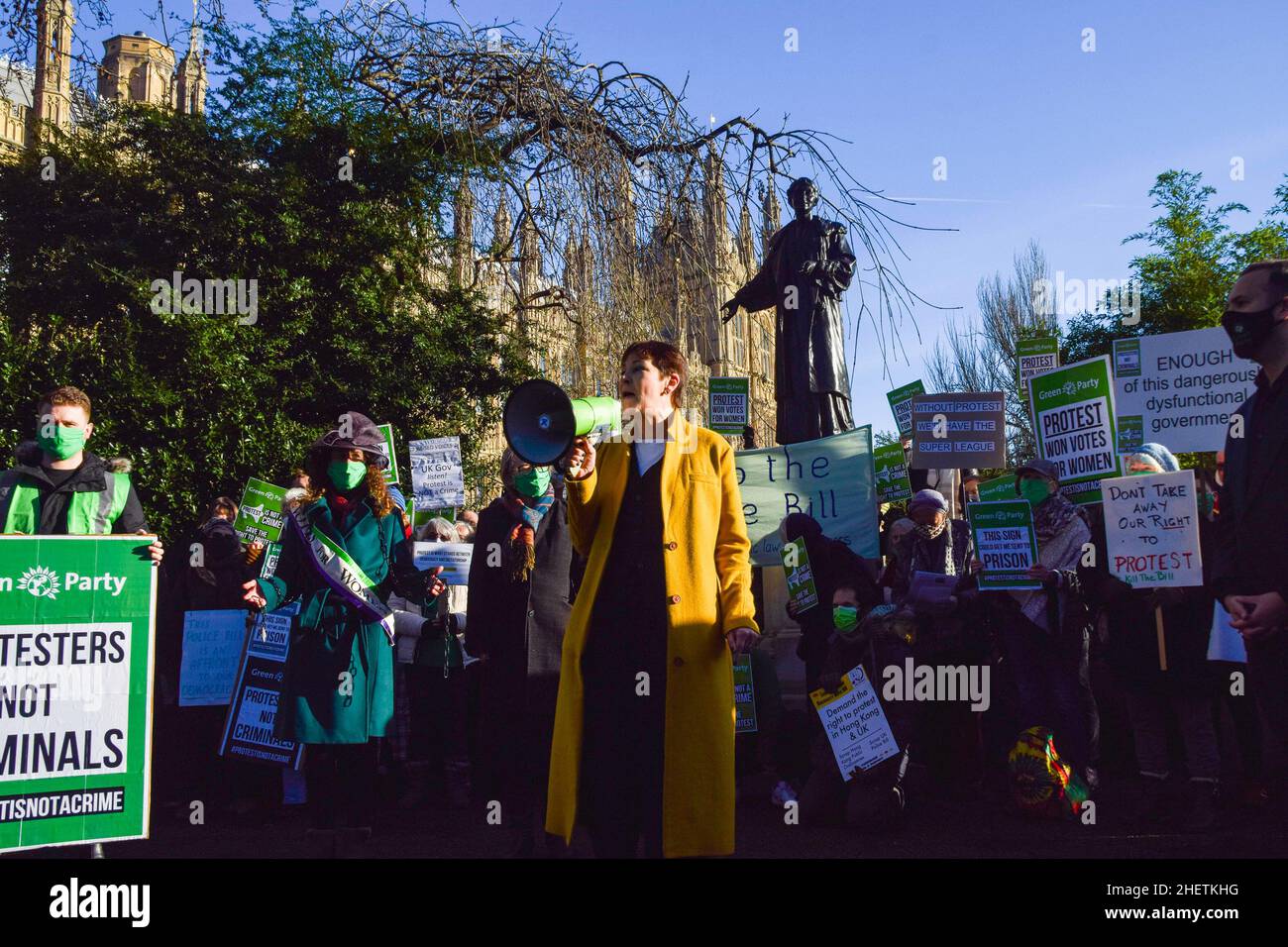 Green Party MP Caroline Lucas speaks to protesters through a megaphone ...