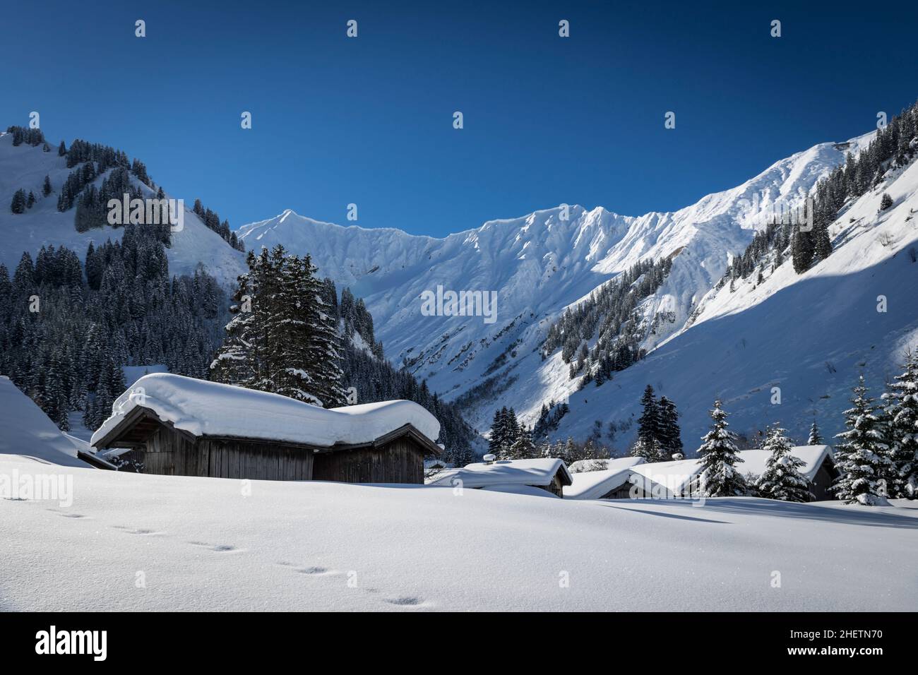 cottages with snow on roof in austrian alps at winter Stock Photo - Alamy