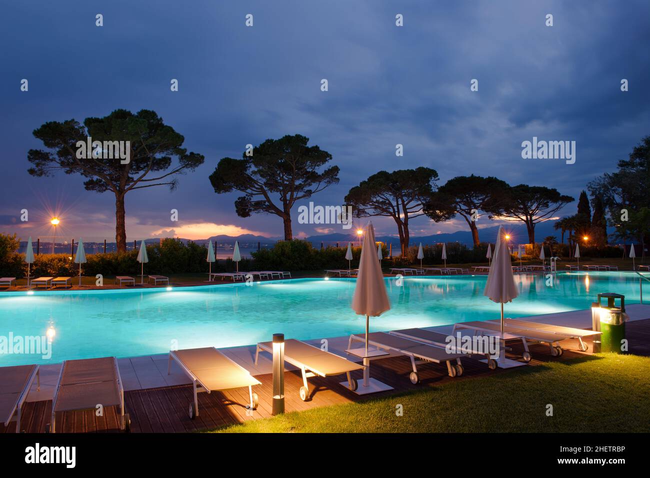 Umbrella sun loungers hotel pool hi-res stock photography and images ...