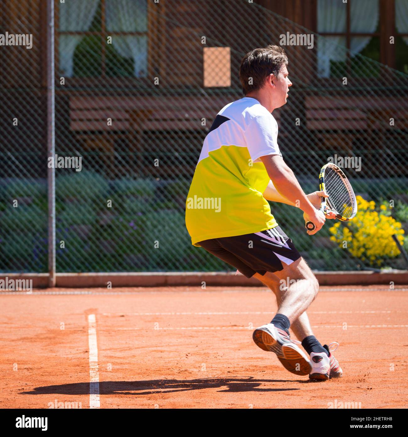 tennis player moving backwards to reach the ball Stock Photo - Alamy