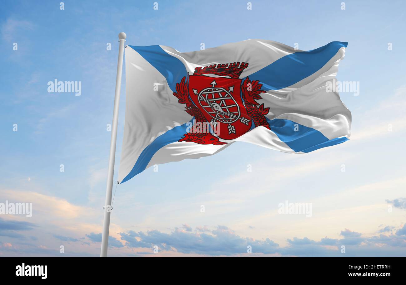 flag of Rio de Janeiro , Brazil at cloudy sky background on sunset ...
