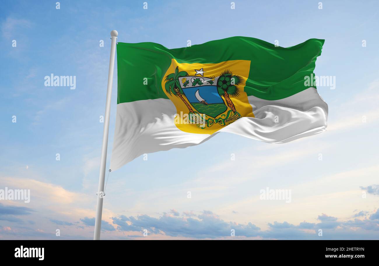 flag of Rio Grande do Norte , Brazil at cloudy sky background on sunset ...