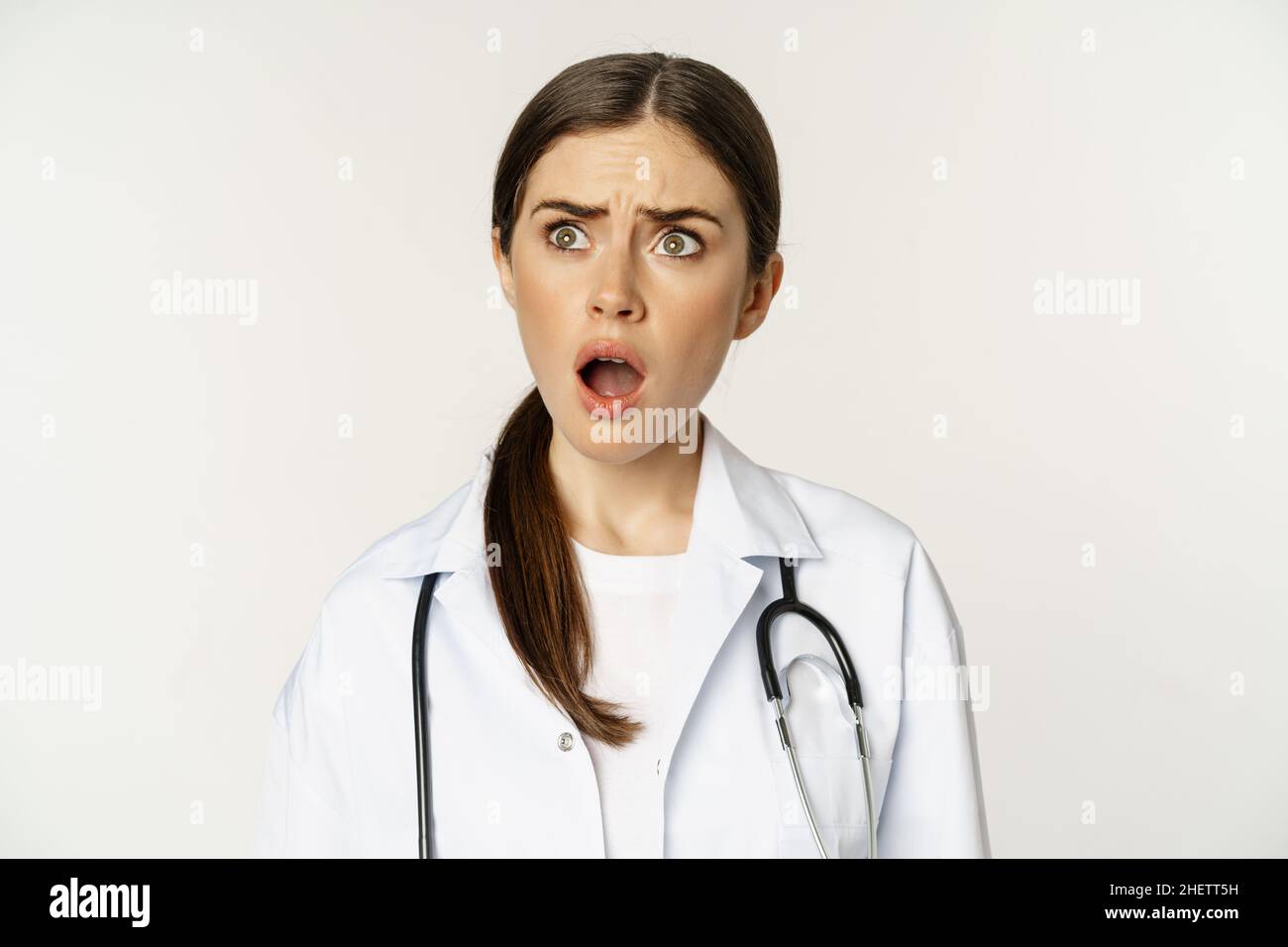 Frustrated and upset young woman, looking left with insulted shocked ...