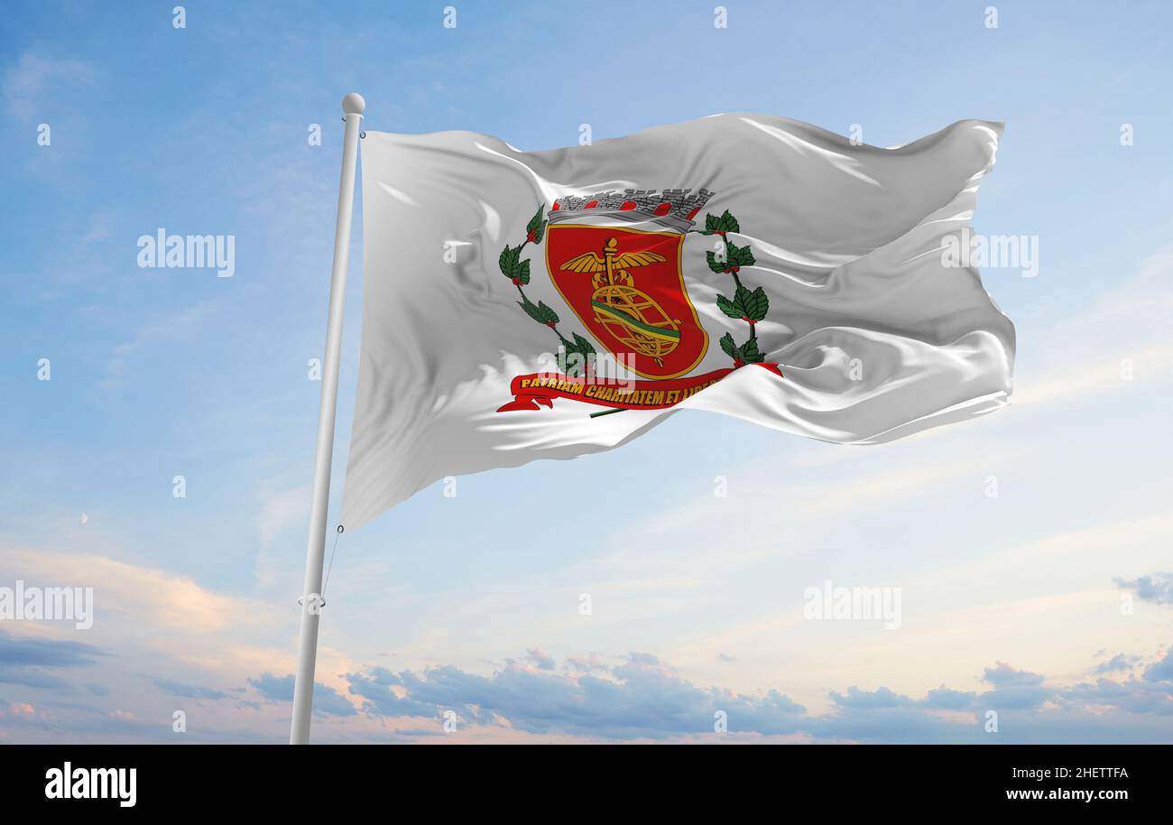flag of Santos Sao Paulo , Brazil at cloudy sky background on sunset ...