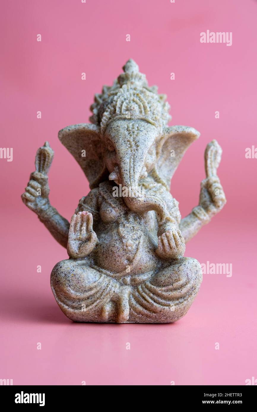Hindu God Ganesha. Ganesha Idol on pink background Stock Photo - Alamy