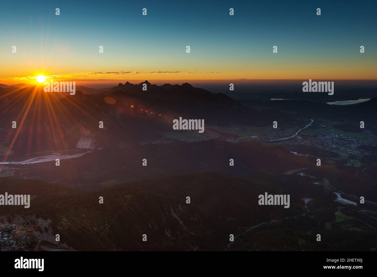 sunbeams at sunset in austrian alps with view in valley Stock Photo - Alamy