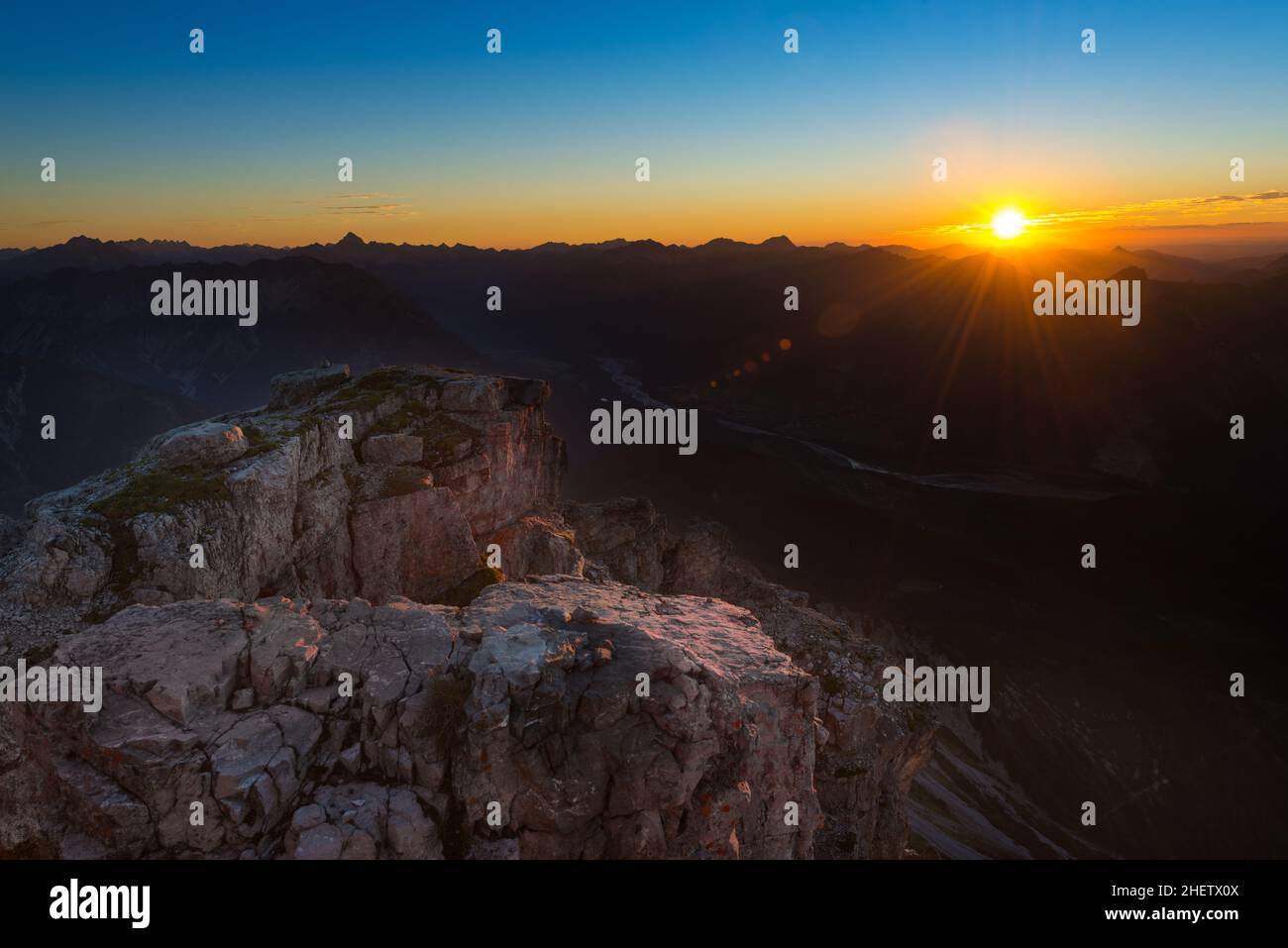 lighted rocks of sunset sun on austrian alp mountains Stock Photo - Alamy
