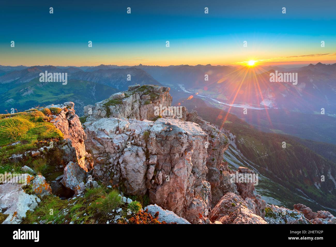 sunbeams while sunset in rocky tyrol mountains austria Stock Photo - Alamy