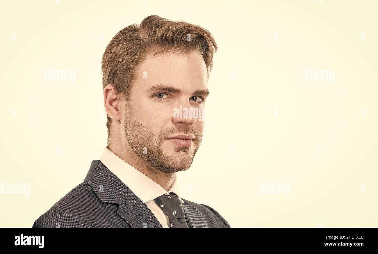 Portrait of serious employee man in formal suit isolated on white copy ...