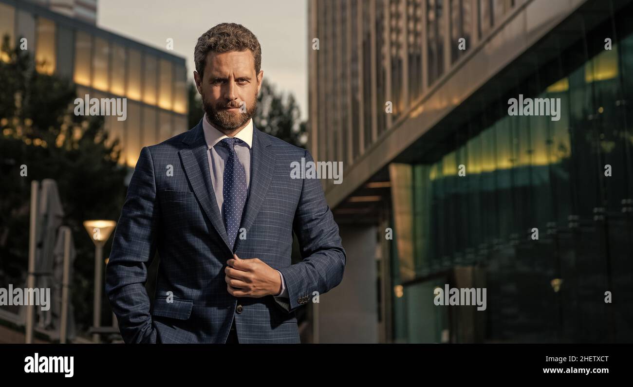 successful man in businesslike suit. manager executive outside the ...