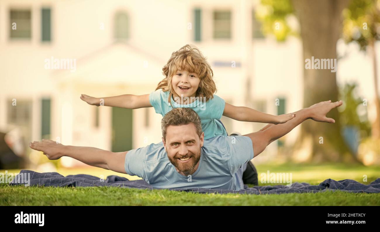 happy father and son having fun in park. family value. childhood and ...