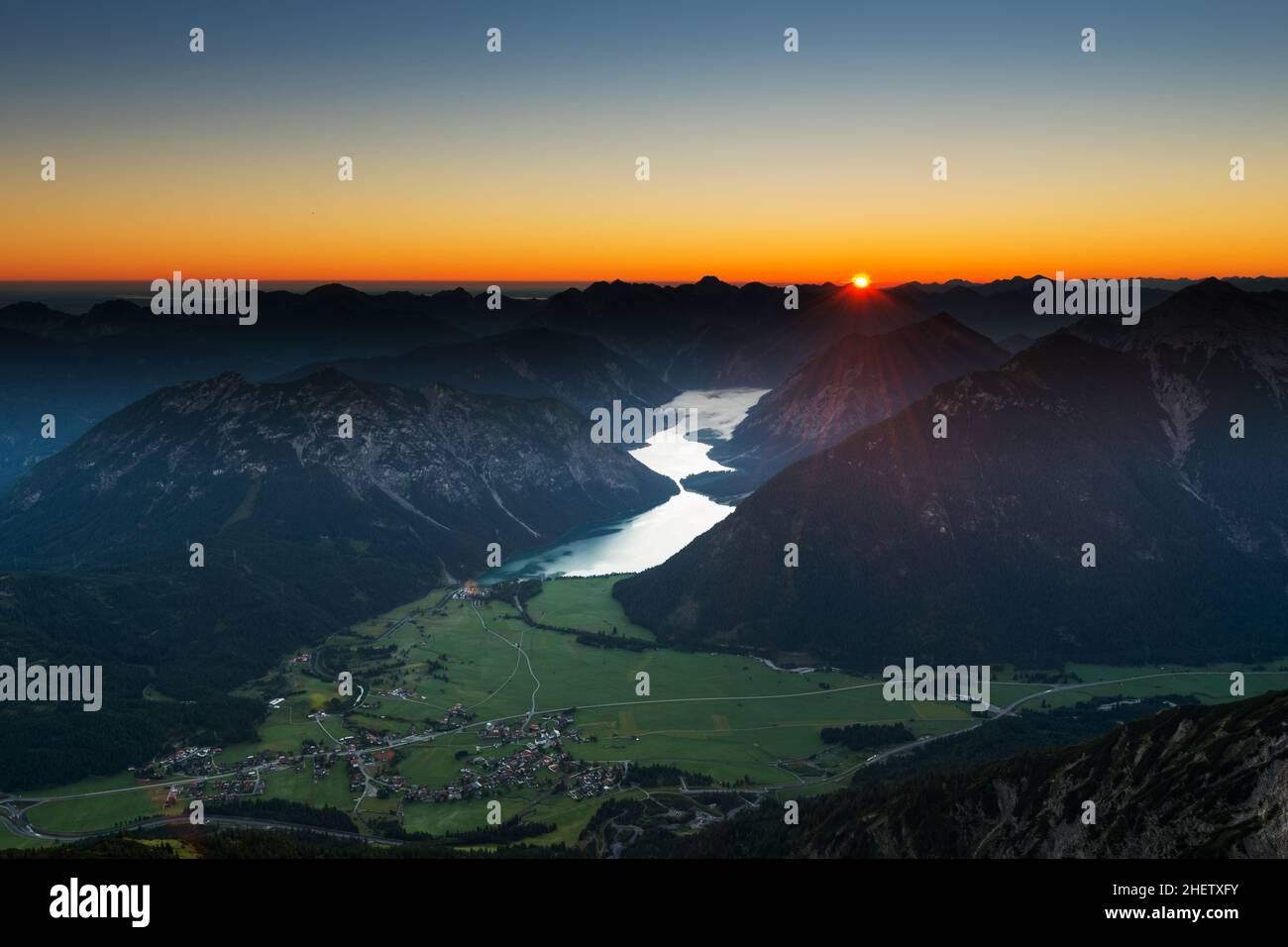 sunrise scene in austrian mountains with view to lake plansee Stock ...