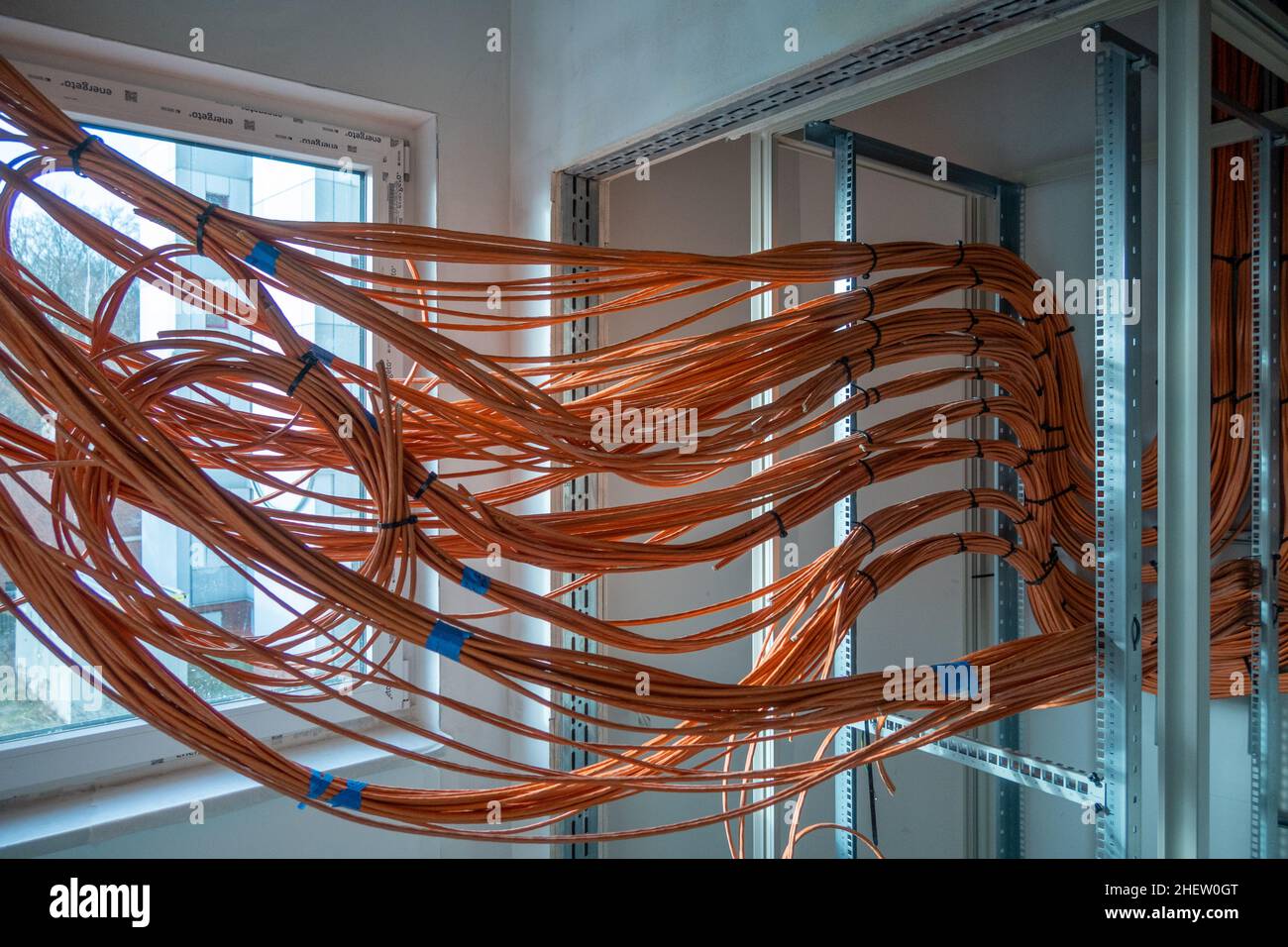 many orange network cables are laid in a new operating theater building ...