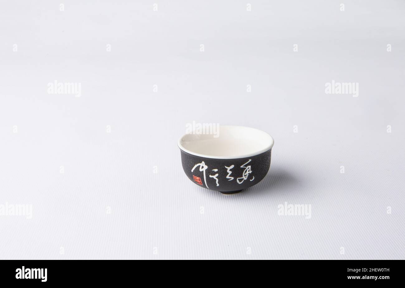 Traditional cup for oriental tea drinking on a white background, copy ...