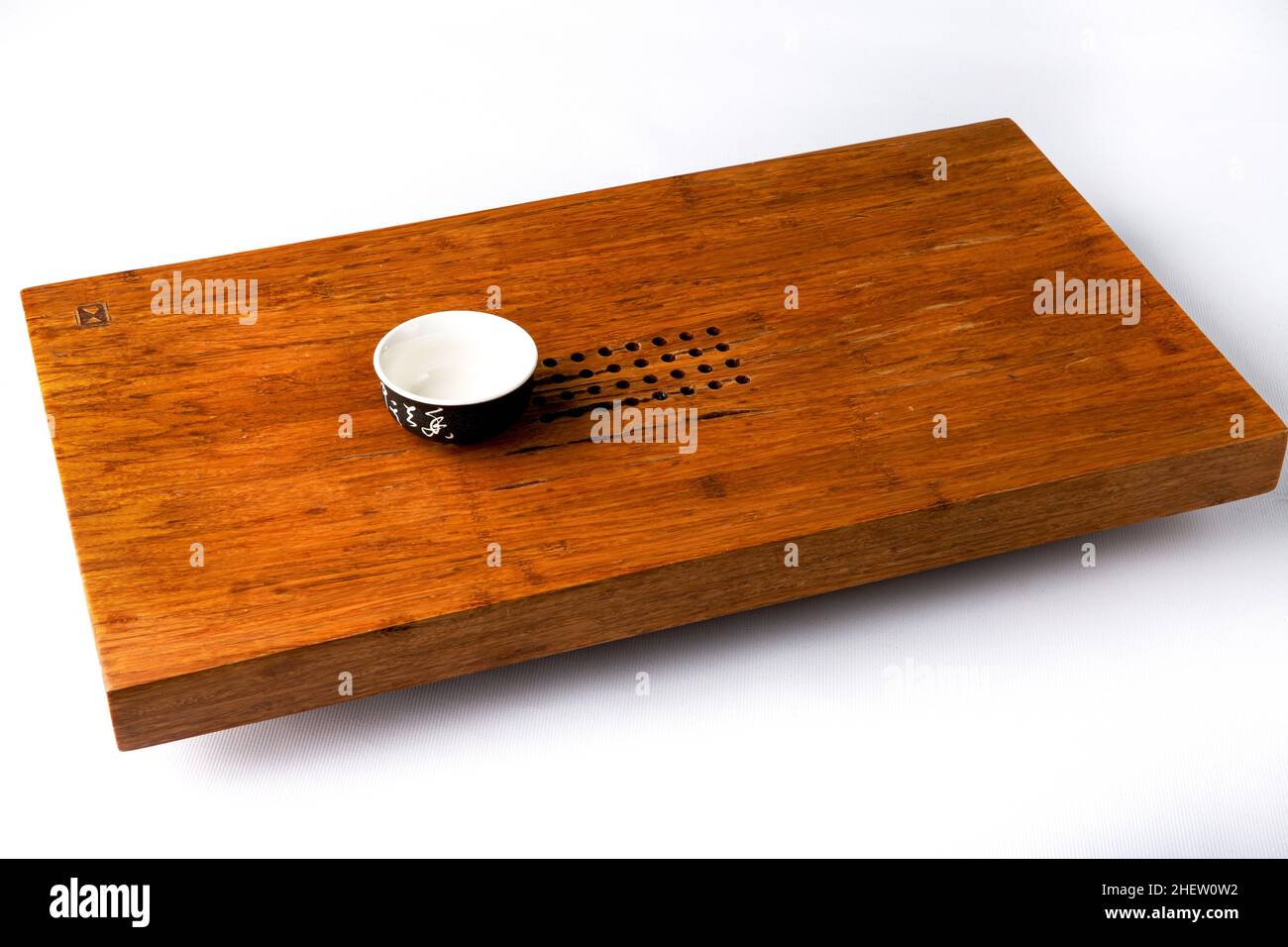 A traditional cup for oriental tea drinking on a wooden table for tea ...