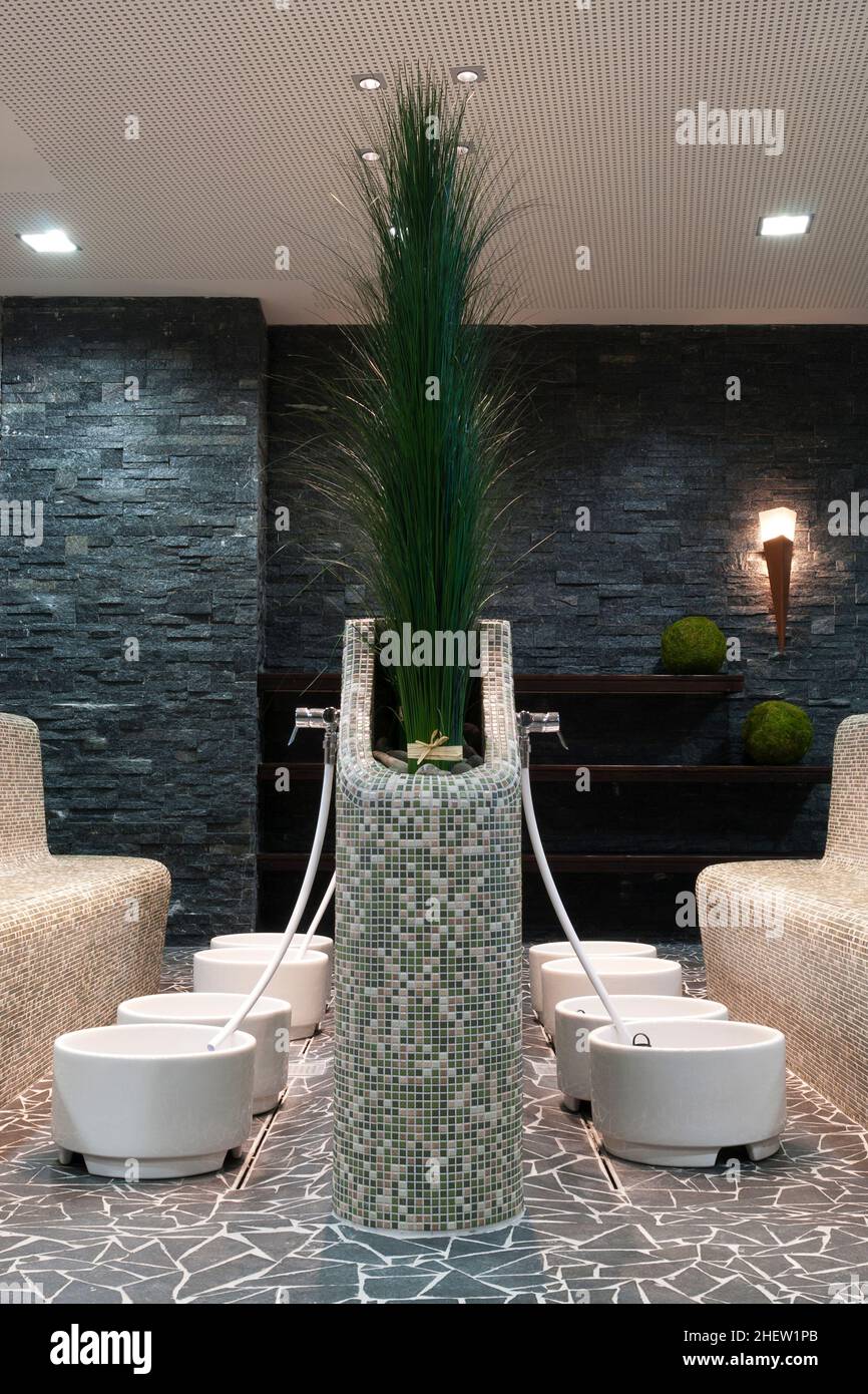 green plants in a small room divider at a public swimming bath. white ...