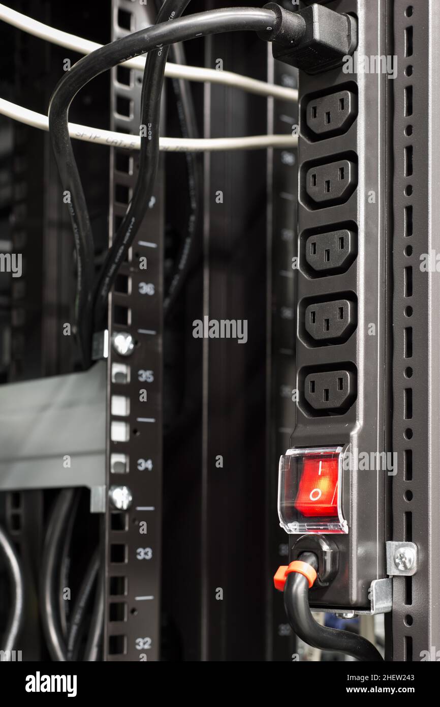 black power bar in server rack with red main switch button Stock Photo ...