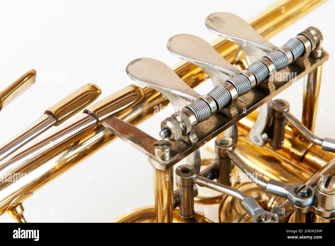 silver golden trumpet valves in detail view with white background Stock ...