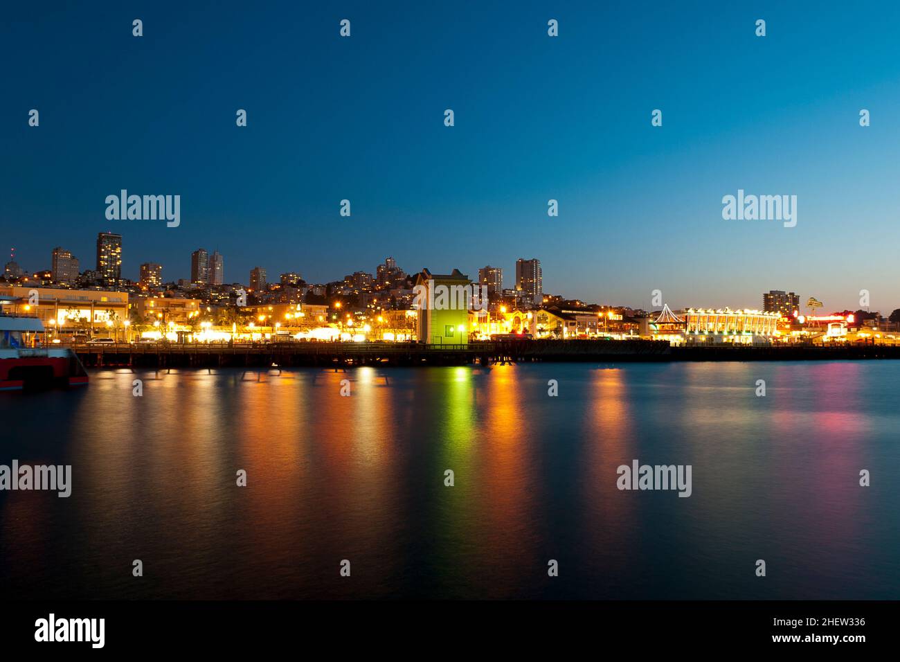 skyline of promenade by night with reflecting lights in the ocean Stock ...