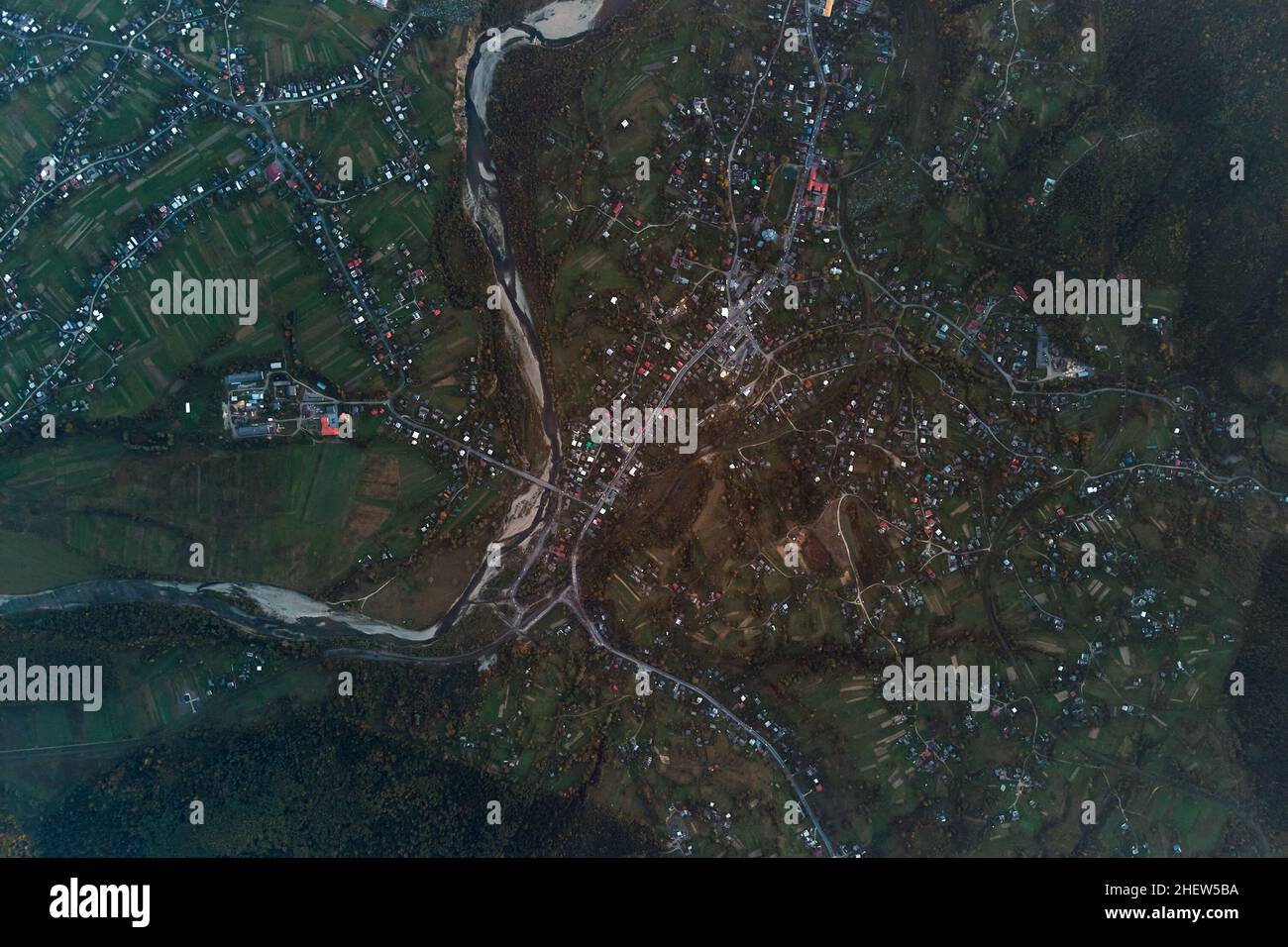 Aerial view from high altitude of distant scattered houses in rural ...