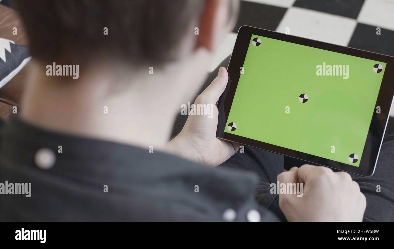 Technology and internet concept, over the shoulder view of a man ...