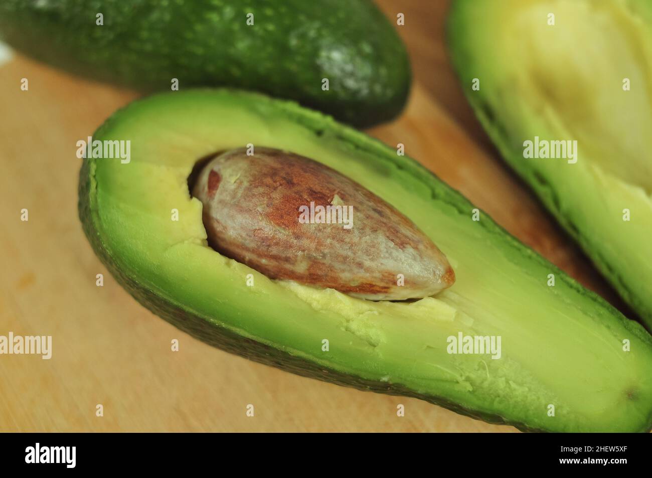 A half of Green fresh raw avocado with pit . High quality photo Stock ...