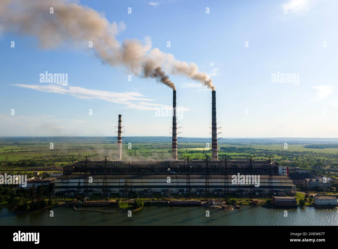 Aerial view of coal power plant high pipes with black smokestack ...