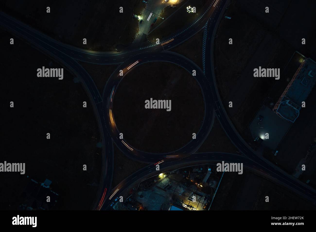 Aerial view of road roundabout intersection with fast moving heavy ...