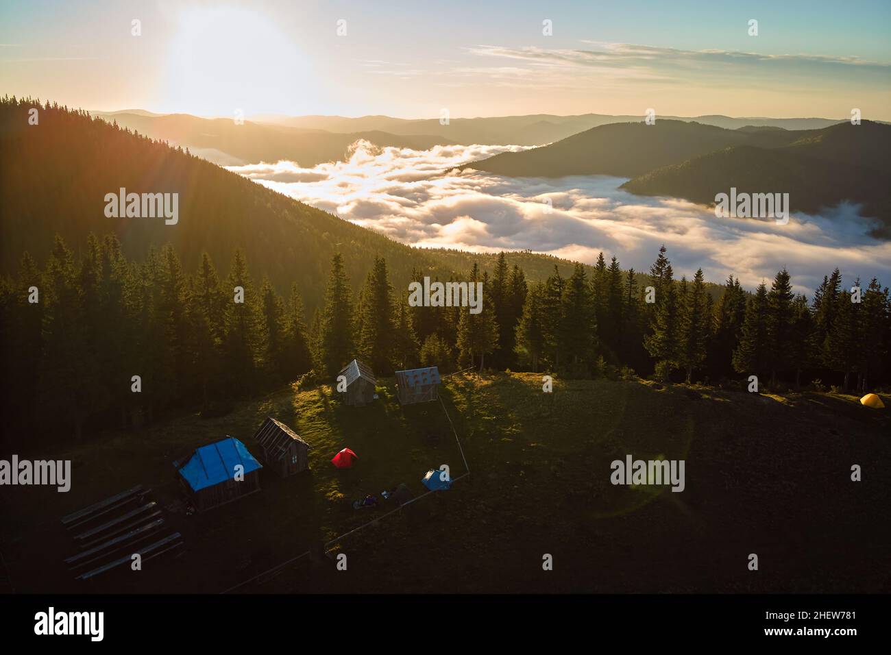 Aerial view of tourist camping tents on mountain campsite at bright ...