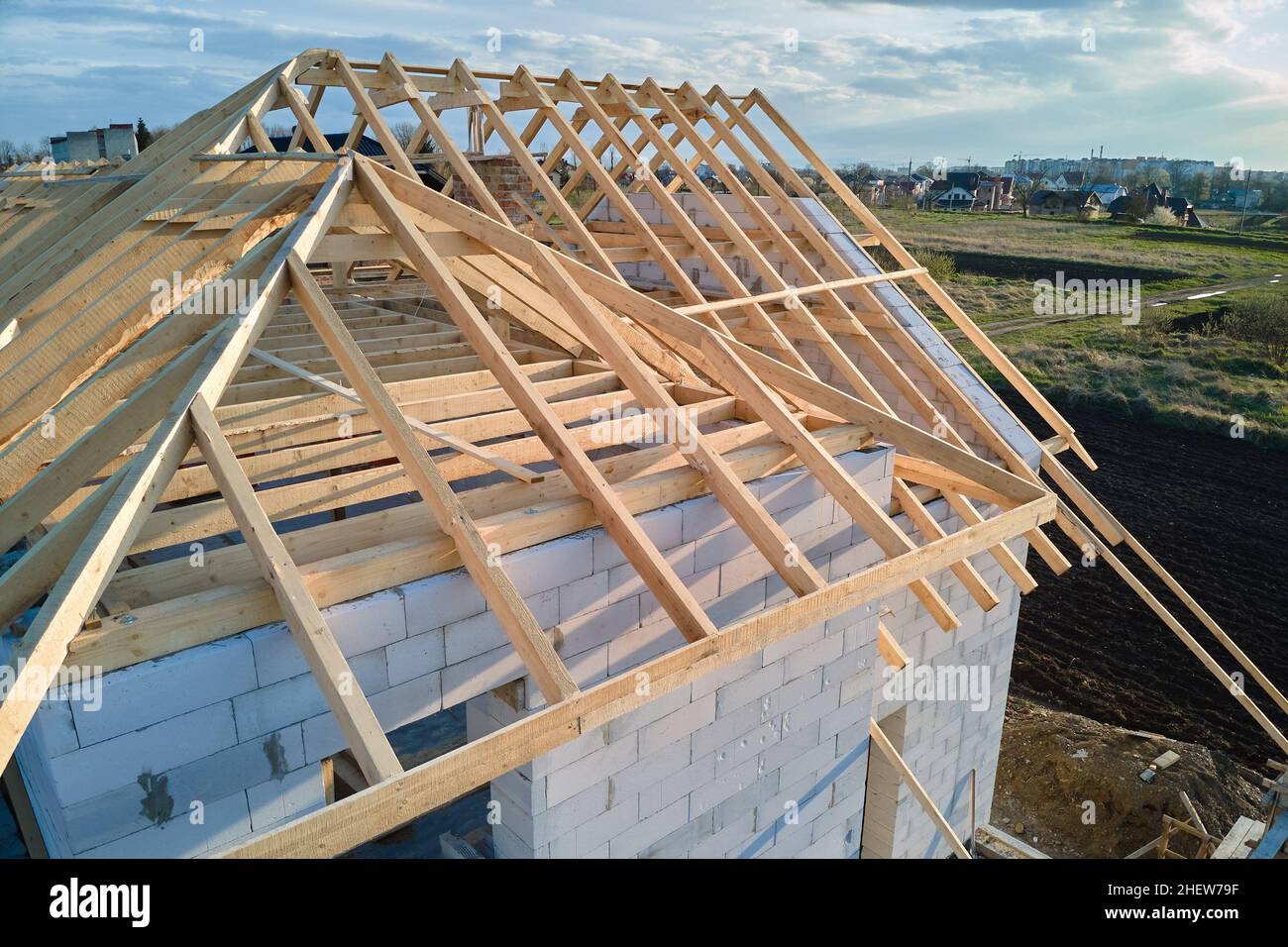 Aerial view of unfinished frame of private house with aerated ...