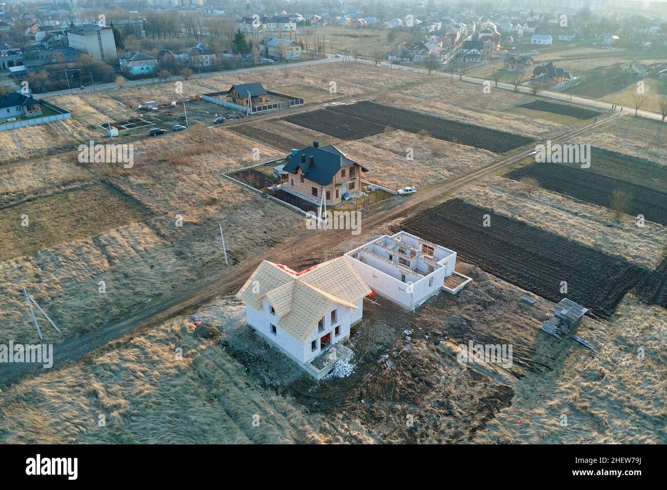 Aerial view of unfinished frame of private house with aerated ...
