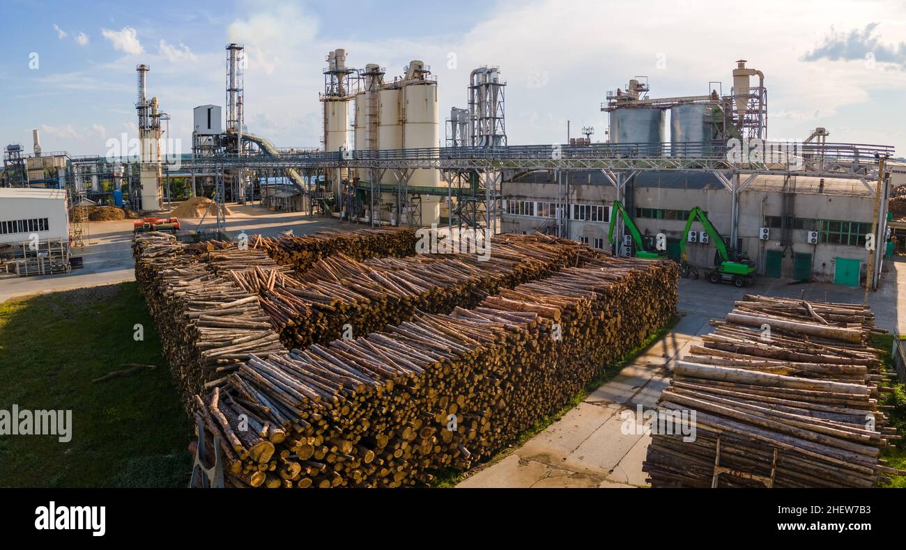 Aerial view of wood processing factory with stacks of lumber at plant ...