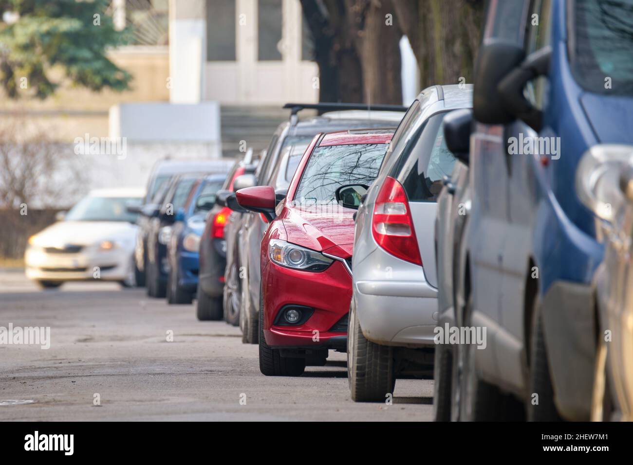 City traffic with cars parked in line on street side Stock Photo - Alamy